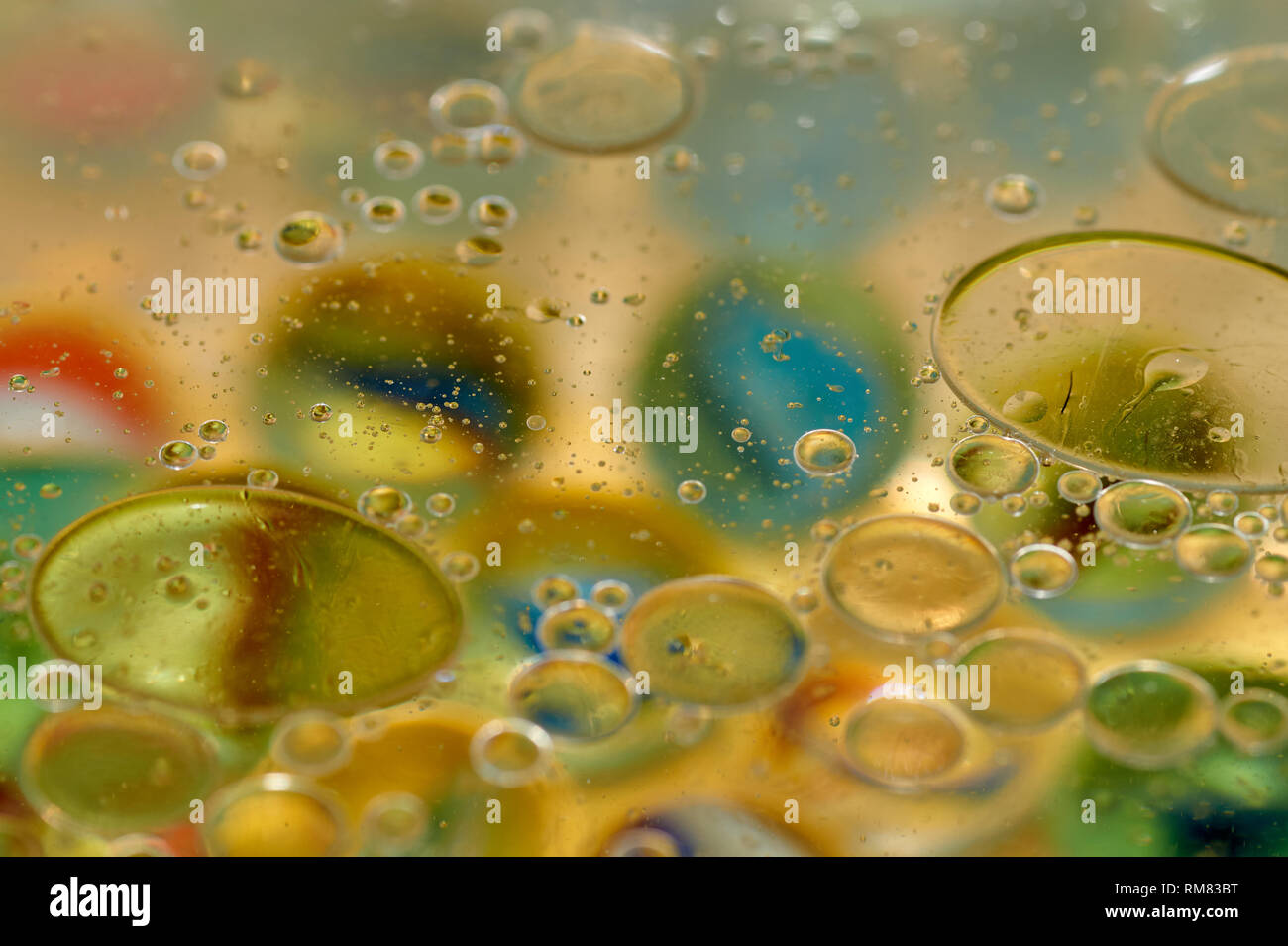 floating in the water abstract colorful, yellow oil drops Stock Photo ...