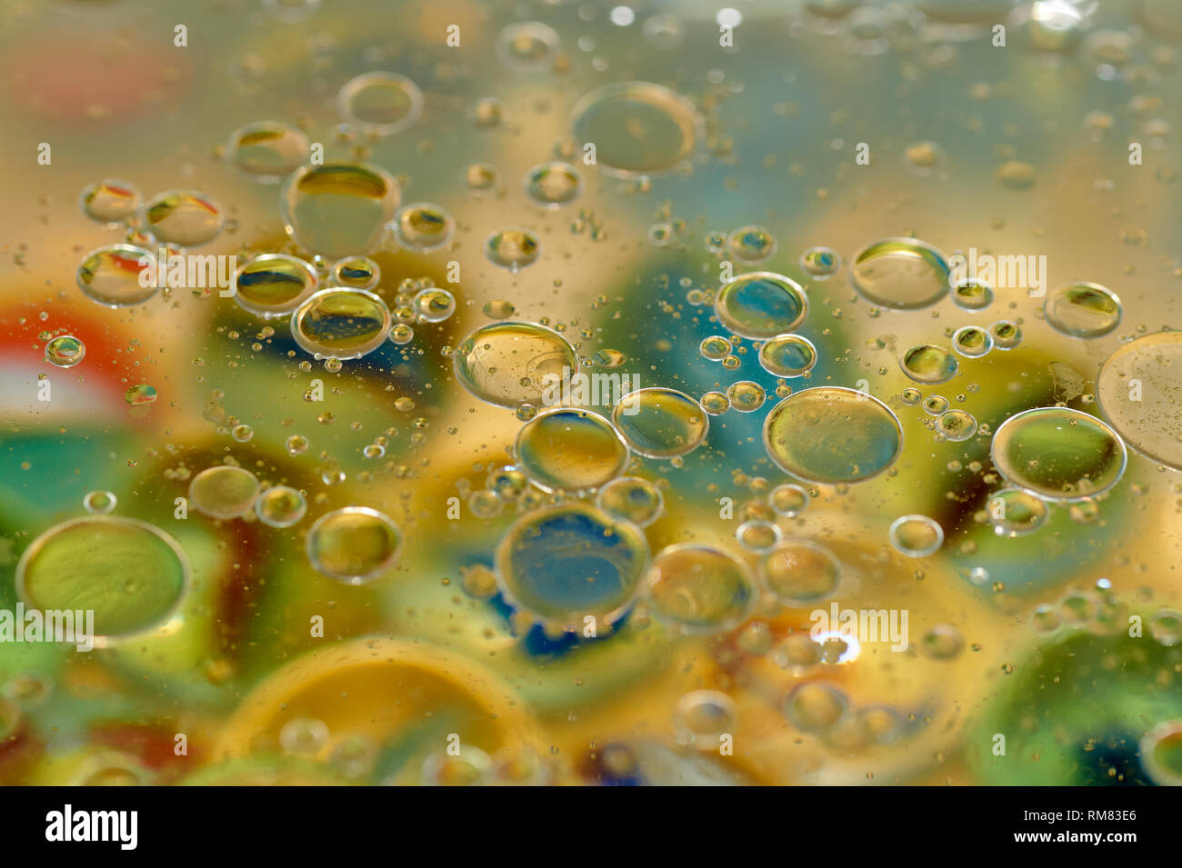 floating in the water abstract colorful, yellow oil drops Stock Photo ...