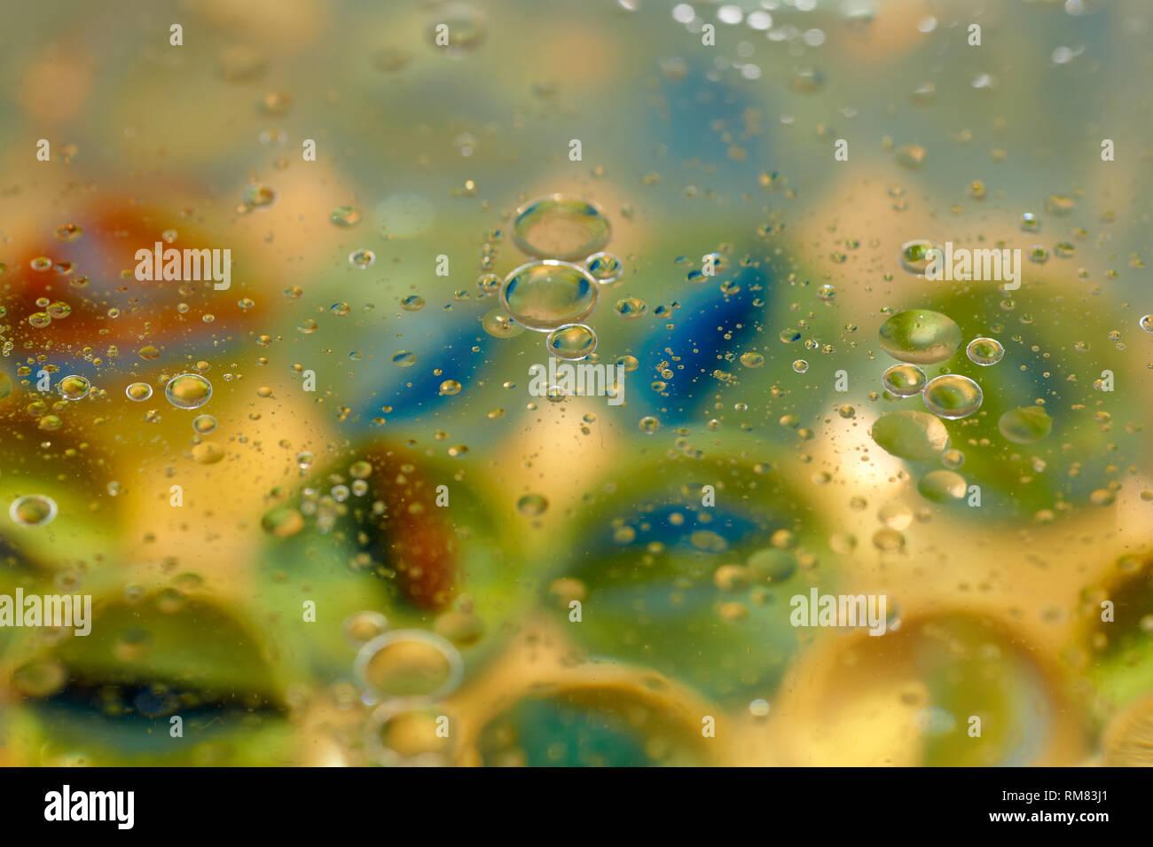 floating in the water abstract colorful, yellow oil drops Stock Photo ...