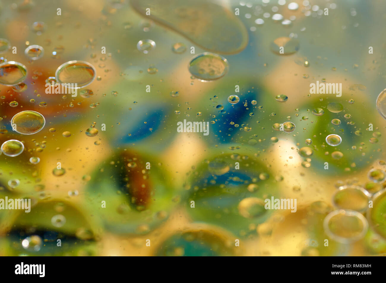 floating in the water abstract colorful, yellow oil drops Stock Photo ...