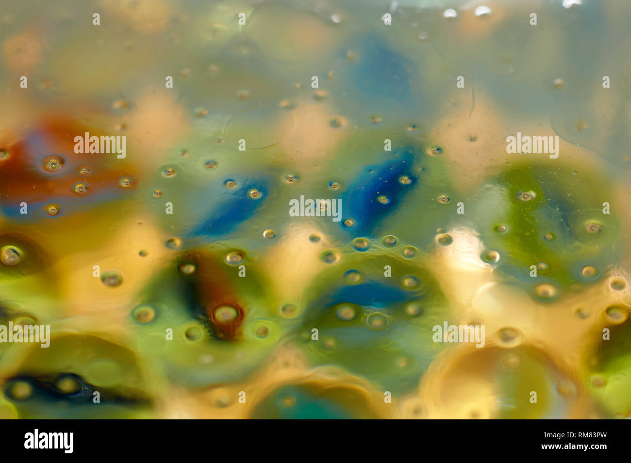 floating in the water abstract colorful, yellow oil drops Stock Photo ...