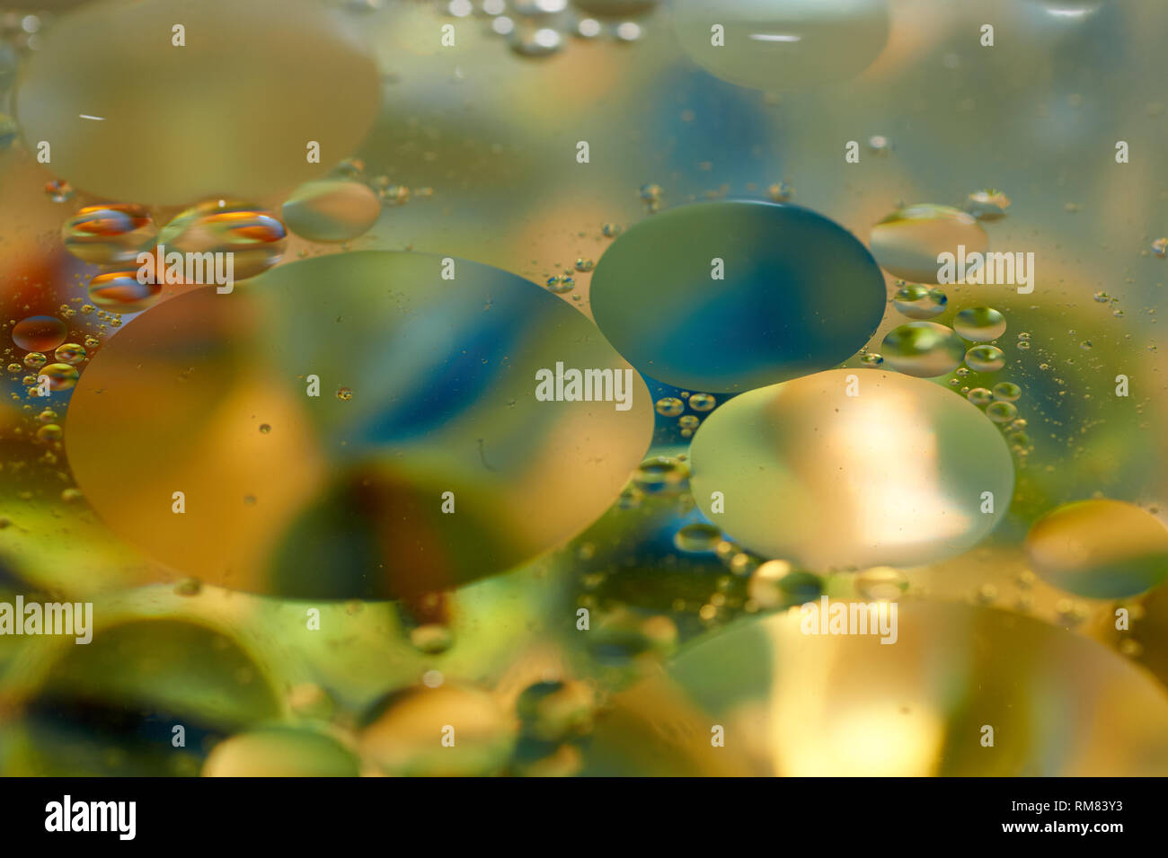 floating in the water abstract colorful, yellow oil drops Stock Photo ...