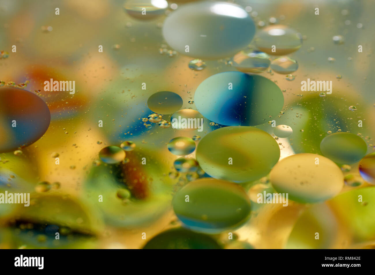floating in the water abstract colorful, yellow oil drops Stock Photo ...