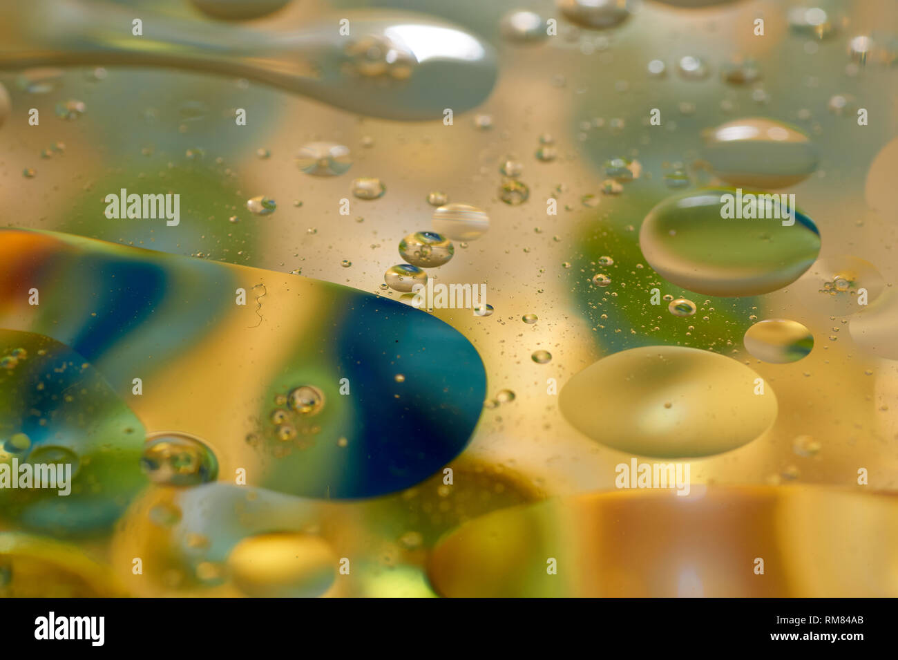 floating in the water abstract colorful, yellow oil drops Stock Photo ...