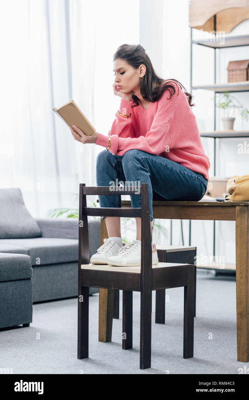 Indian student reading book hi-res stock photography and images - Alamy