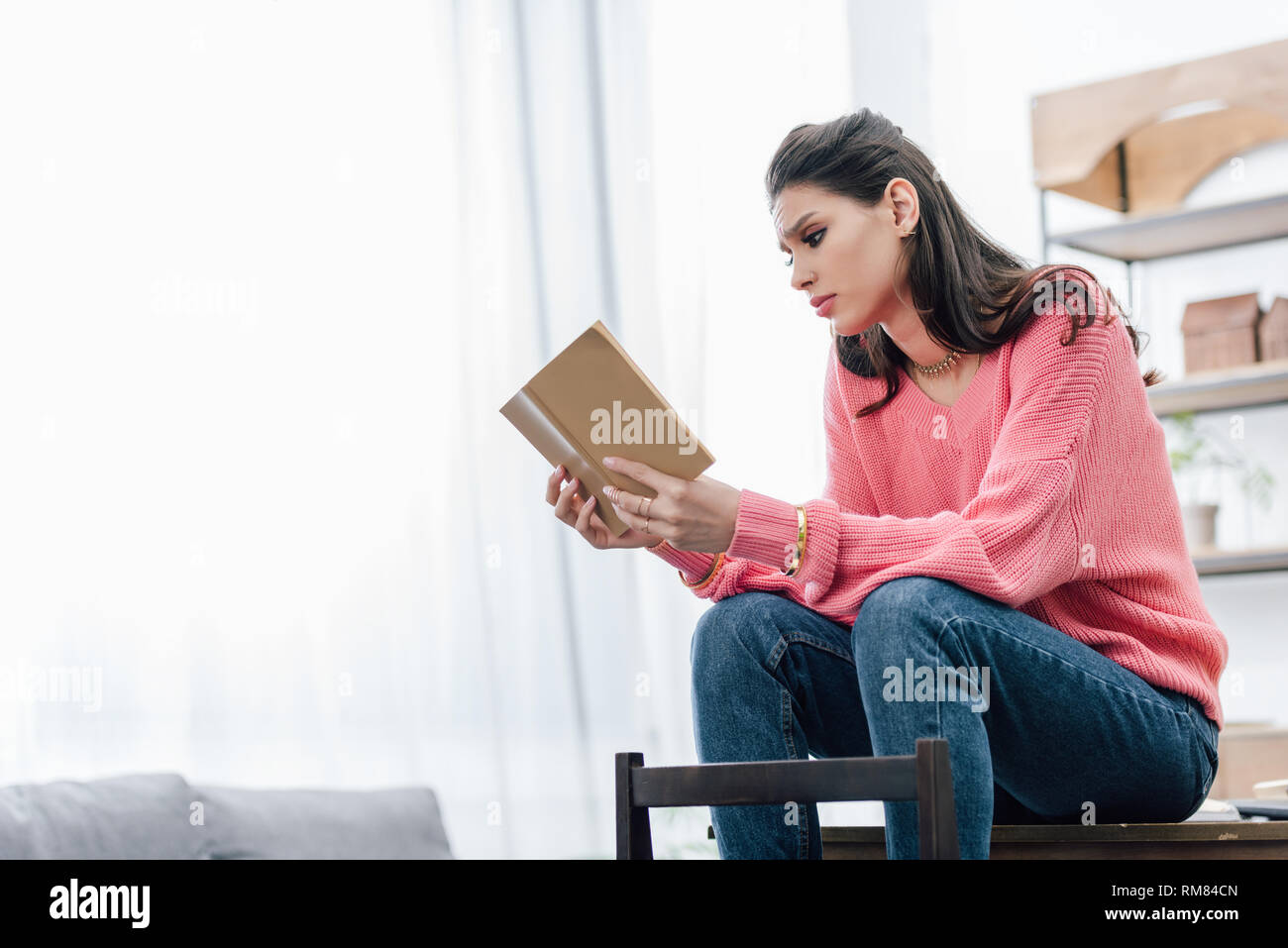 Indian student reading book hi-res stock photography and images - Alamy