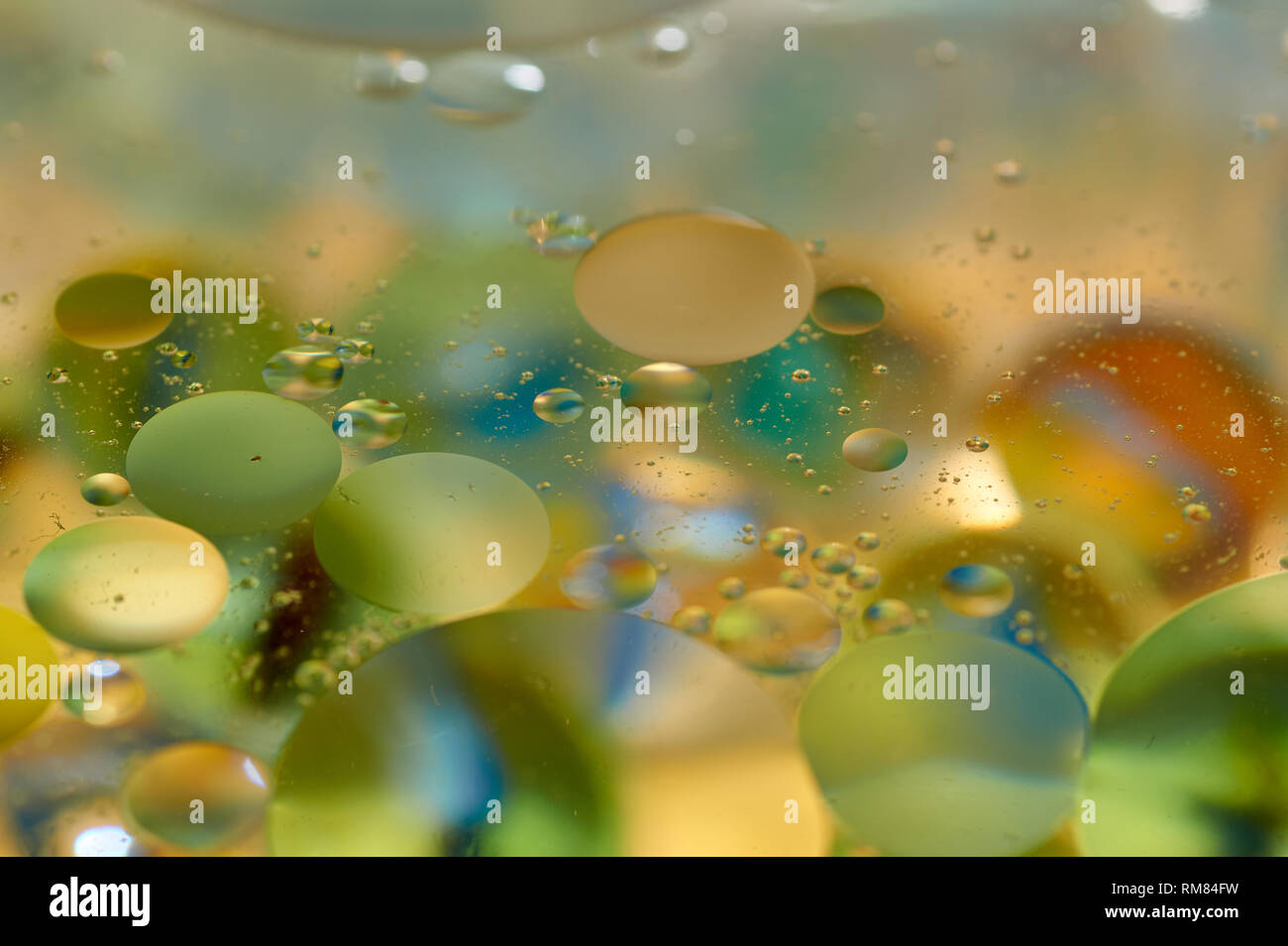 floating in the water abstract colorful, yellow oil drops Stock Photo ...
