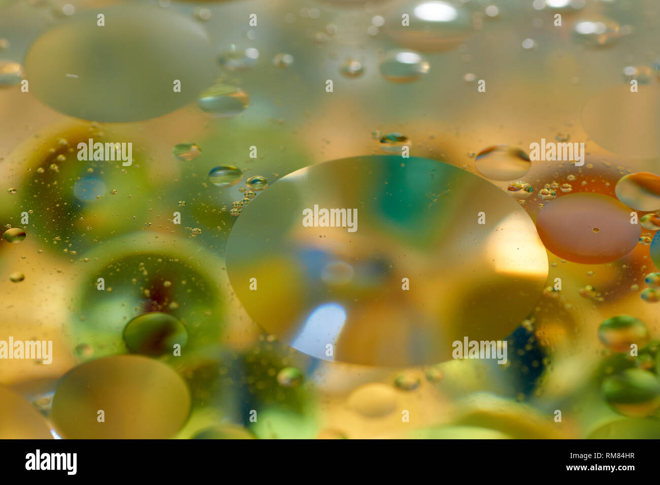 floating in the water abstract colorful, yellow oil drops Stock Photo ...