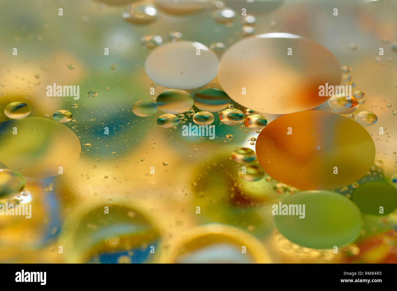 floating in the water abstract colorful, yellow oil drops Stock Photo ...