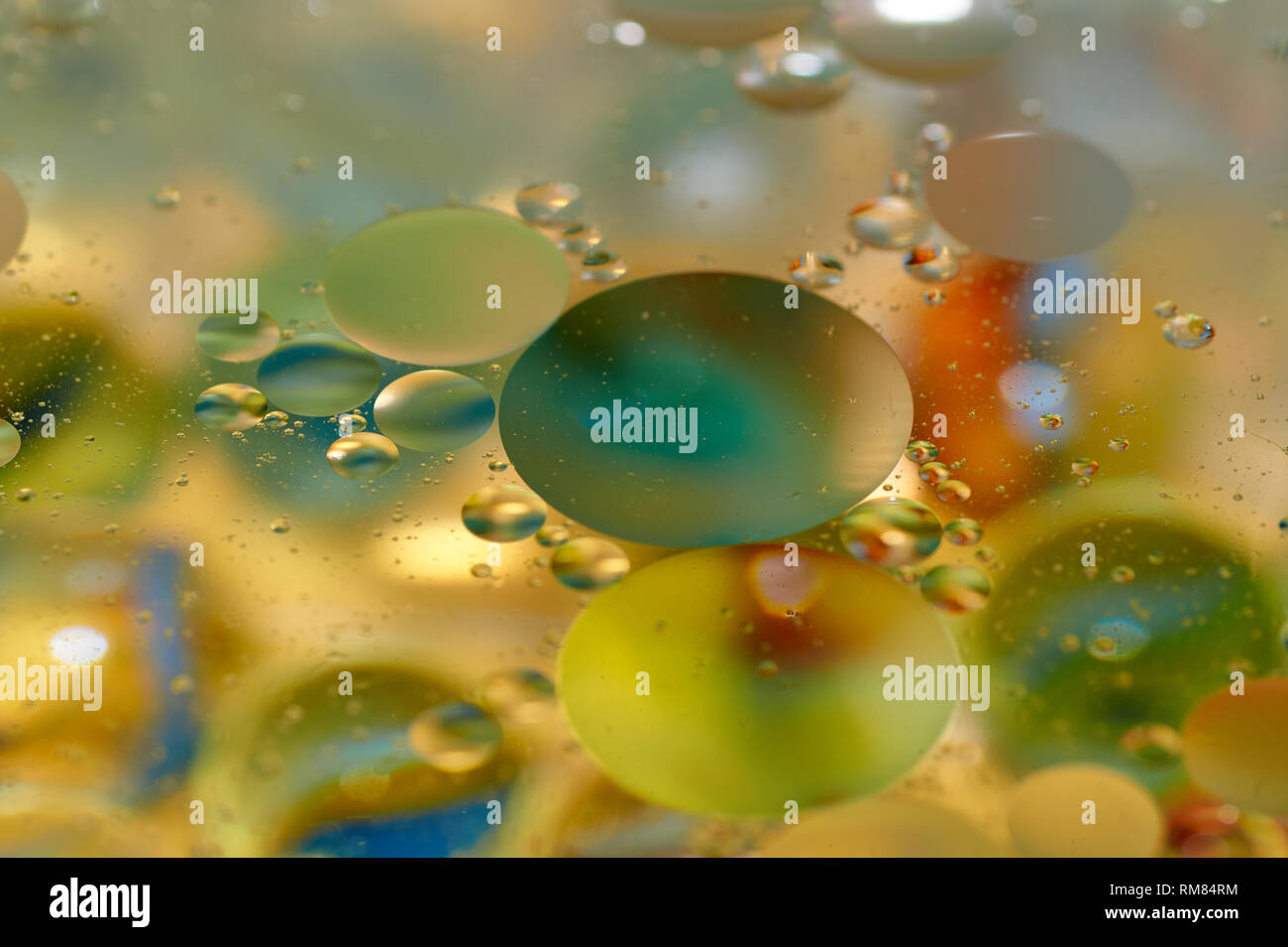 floating in the water abstract colorful, yellow oil drops Stock Photo ...