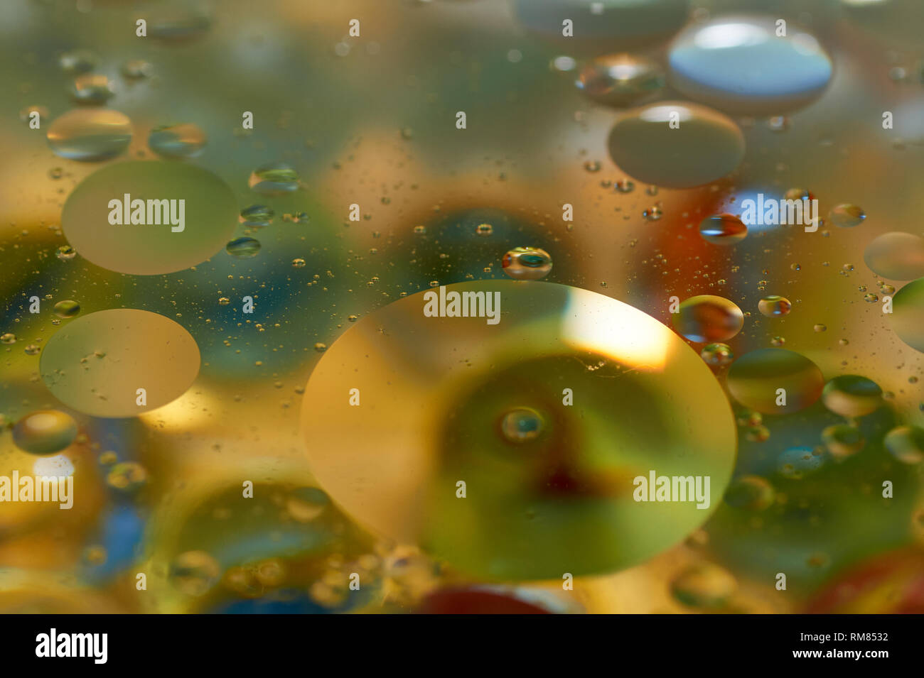 floating in the water abstract colorful, yellow oil drops Stock Photo ...