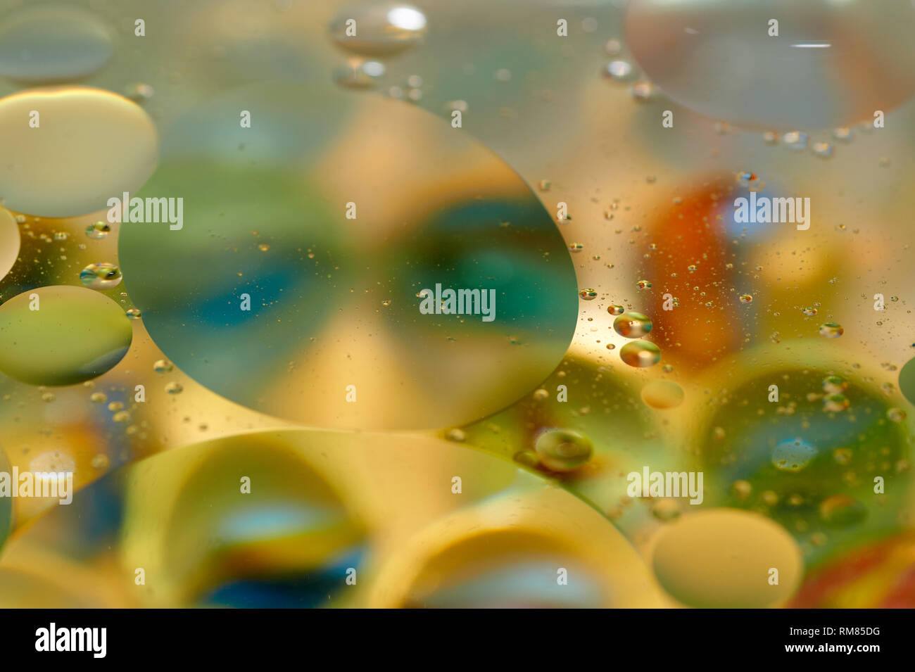 floating in the water abstract colorful, yellow oil drops Stock Photo ...
