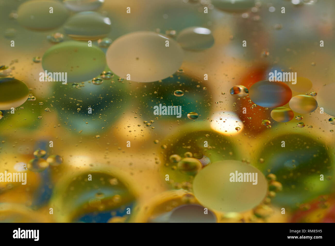 floating in the water abstract colorful, yellow oil drops Stock Photo ...
