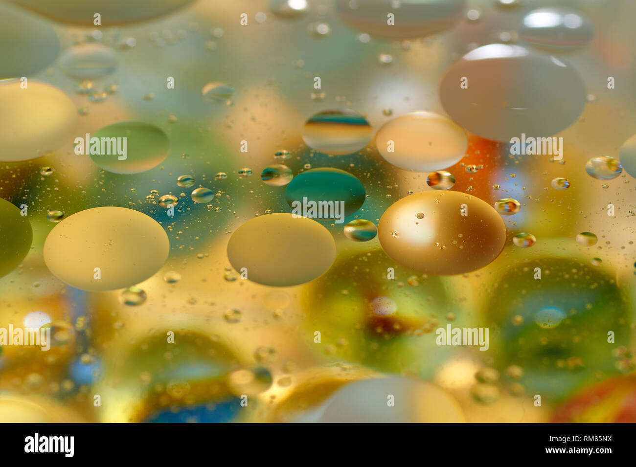 floating in the water abstract colorful, yellow oil drops Stock Photo ...