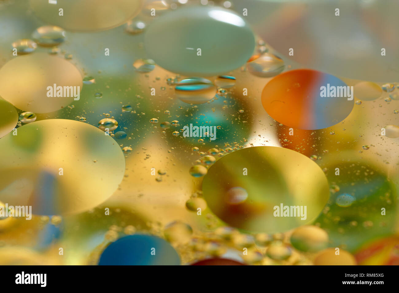 floating in the water abstract colorful, yellow oil drops Stock Photo ...