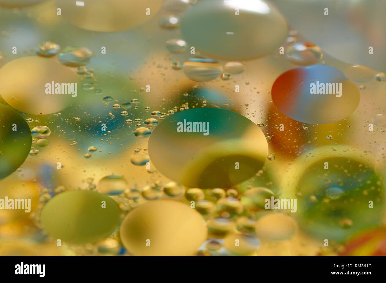 floating in the water abstract colorful, yellow oil drops Stock Photo ...