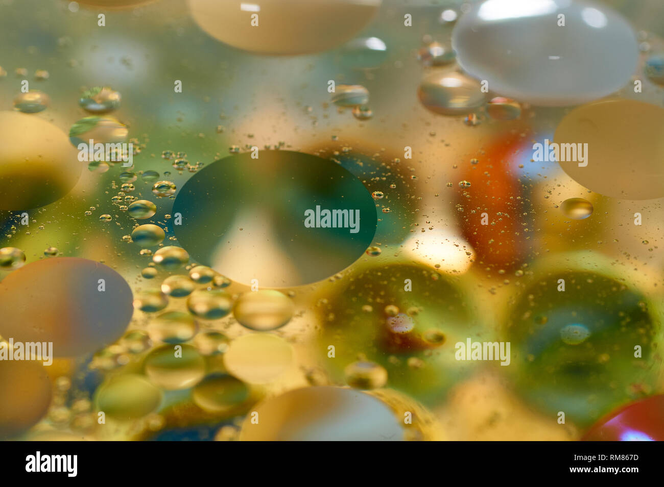 floating in the water abstract colorful, yellow oil drops Stock Photo ...