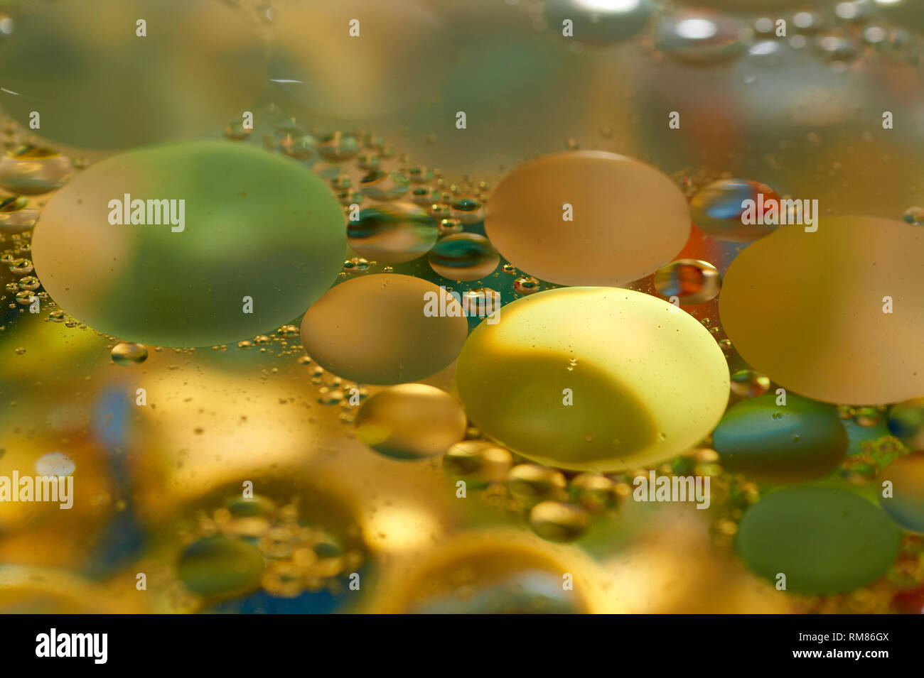 floating in the water abstract colorful, yellow oil drops Stock Photo ...