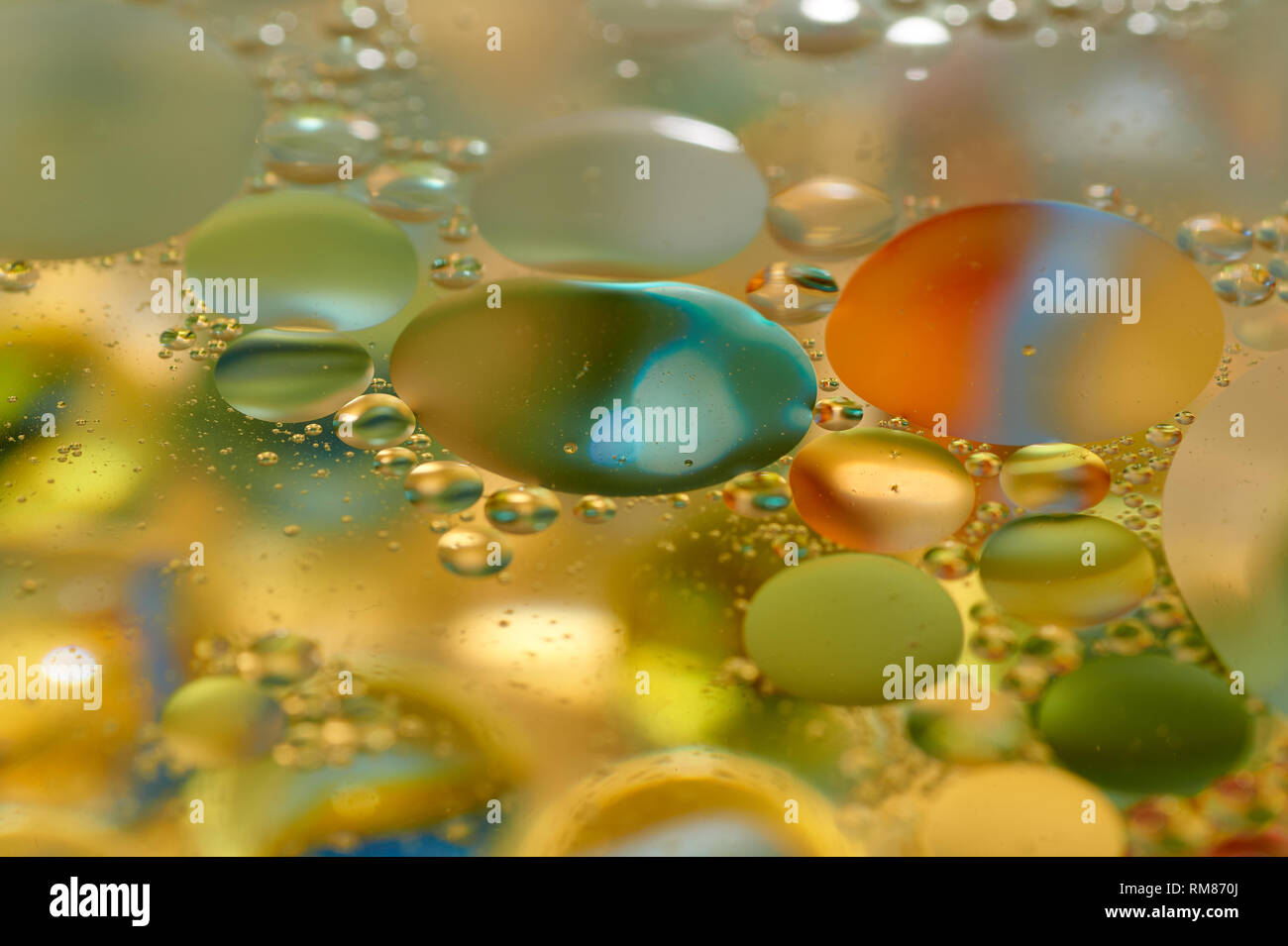 floating in the water abstract colorful, yellow oil drops Stock Photo ...