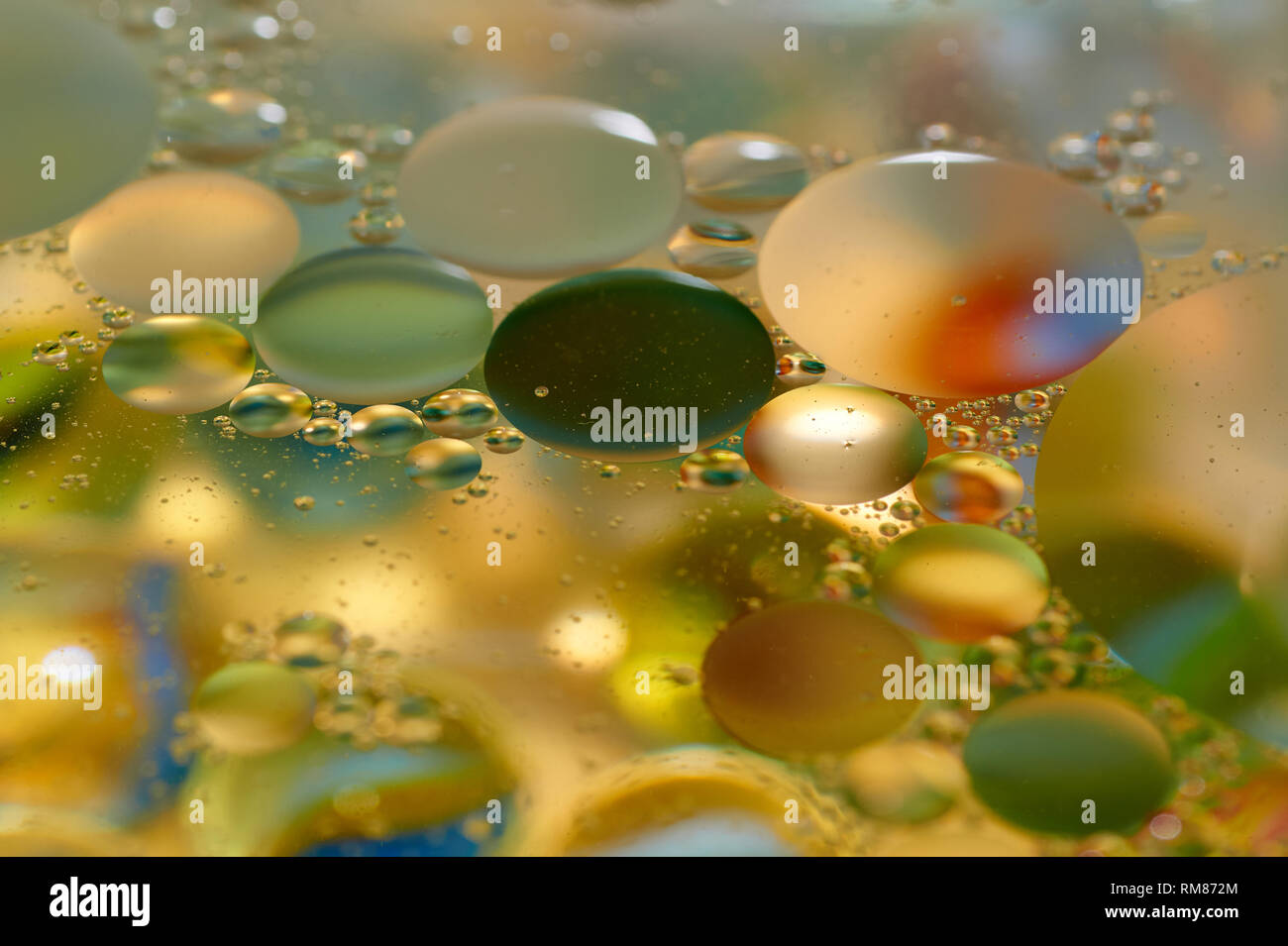 floating in the water abstract colorful, yellow oil drops Stock Photo ...
