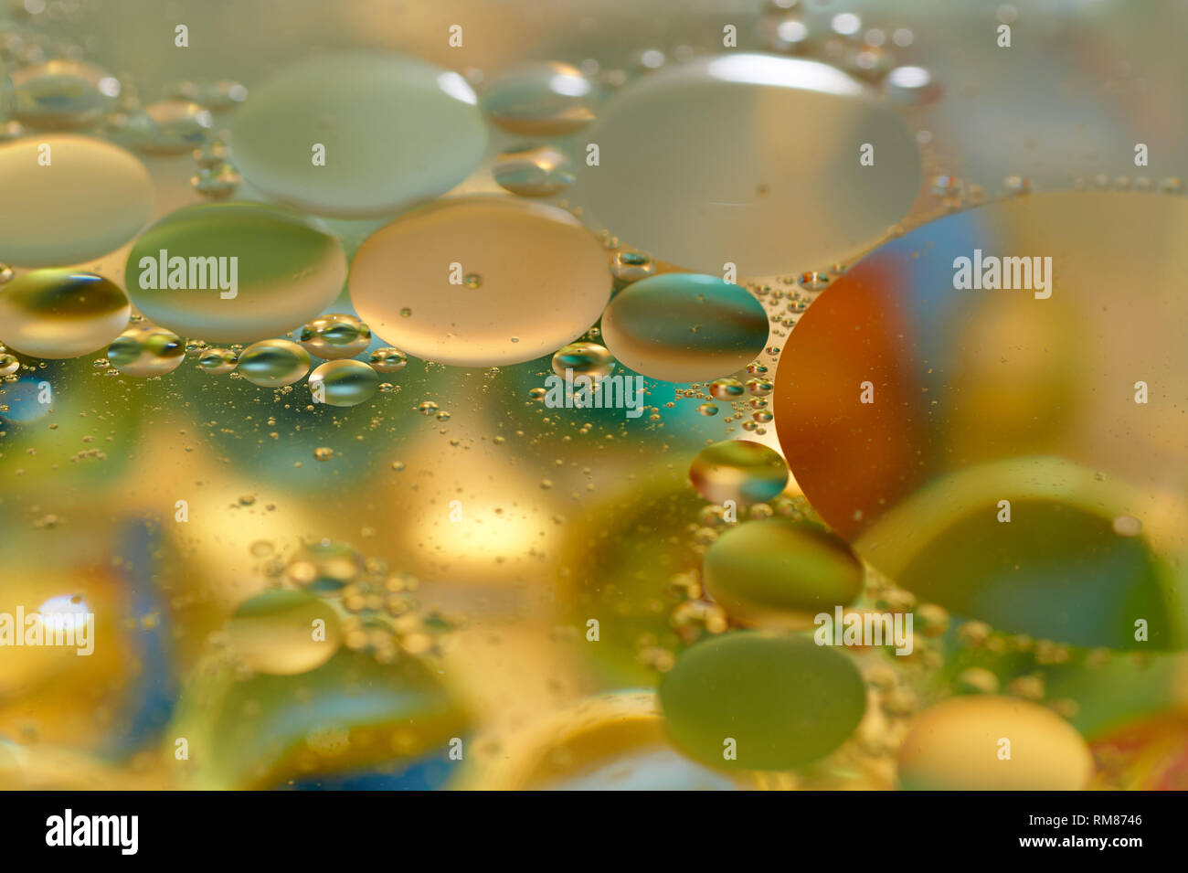 floating in the water abstract colorful, yellow oil drops Stock Photo ...