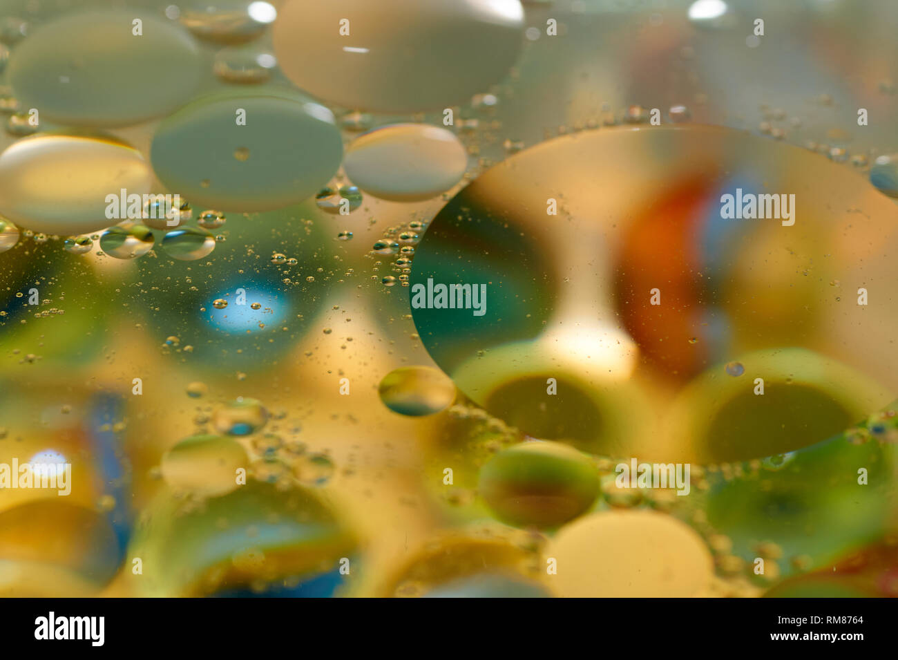 floating in the water abstract colorful, yellow oil drops Stock Photo ...