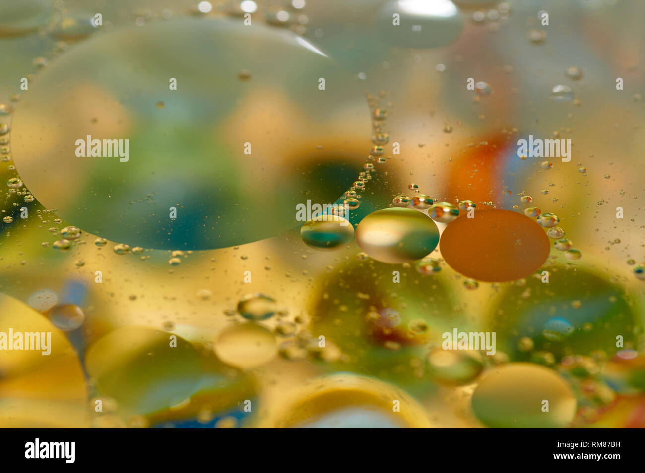 floating in the water abstract colorful, yellow oil drops Stock Photo ...