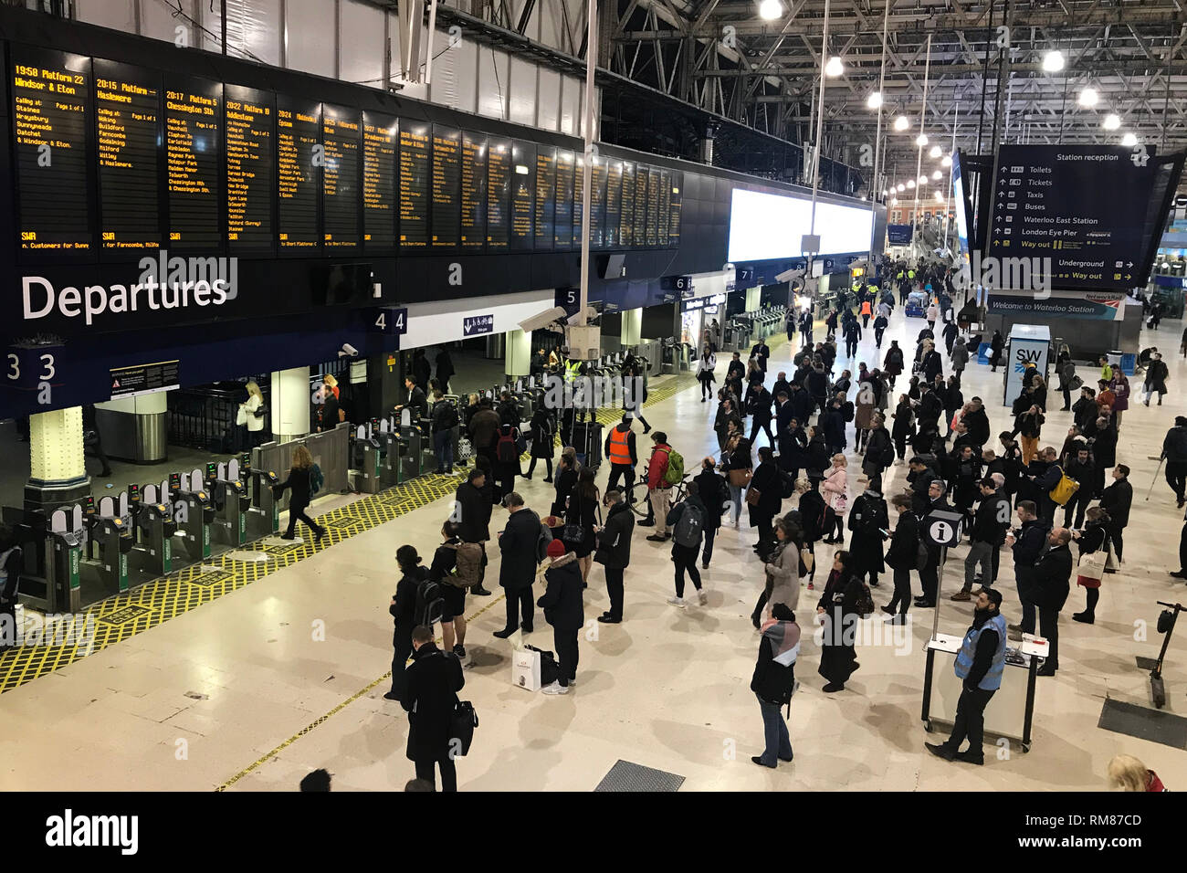 People at Waterloo Station in London, after trains were brought to a ...