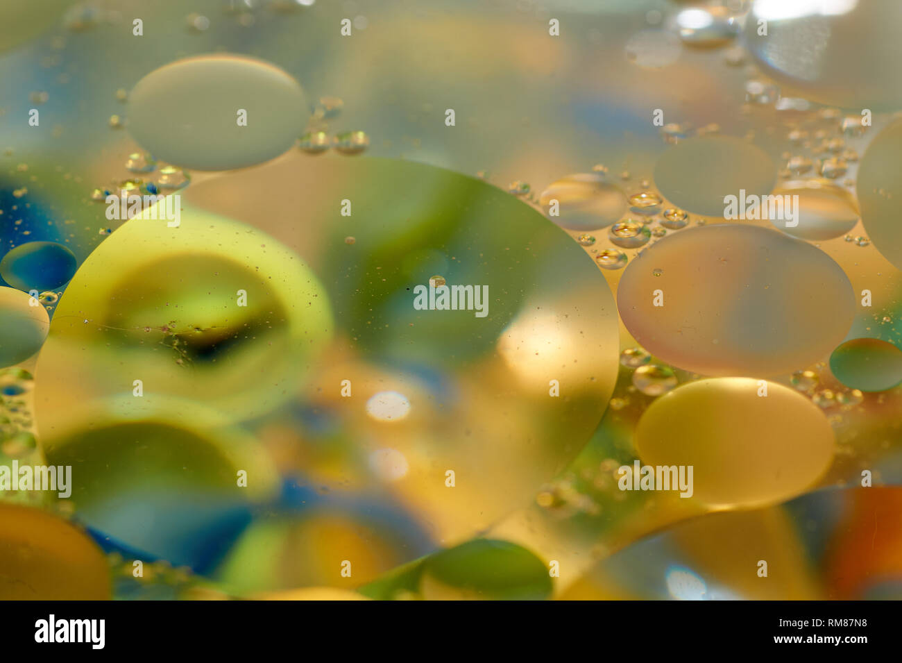 floating in the water abstract colorful, yellow oil drops Stock Photo ...