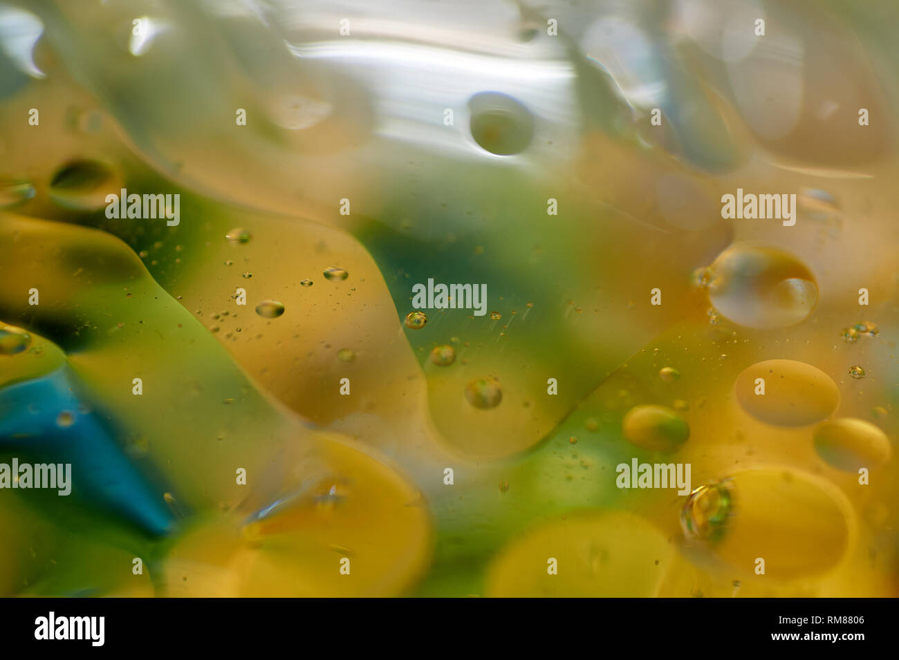 floating in the water abstract colorful, yellow oil drops Stock Photo ...