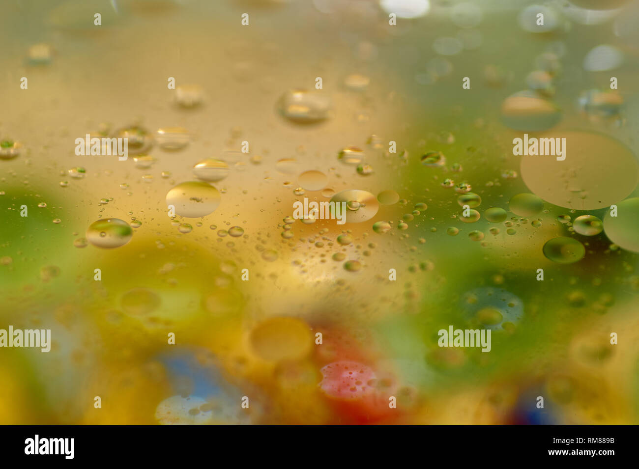 floating in the water abstract colorful, yellow oil drops Stock Photo ...