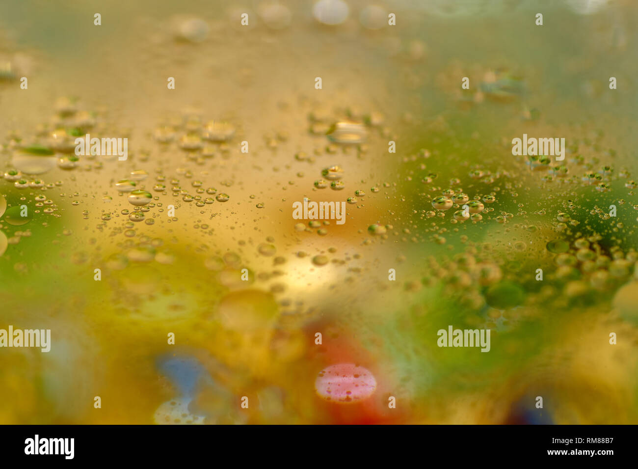 floating in the water abstract colorful, yellow oil drops Stock Photo ...