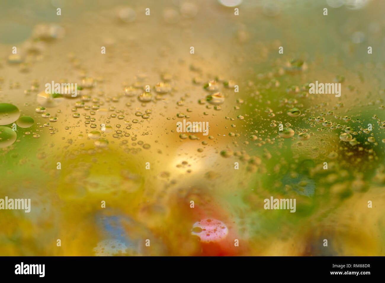 floating in the water abstract colorful, yellow oil drops Stock Photo ...