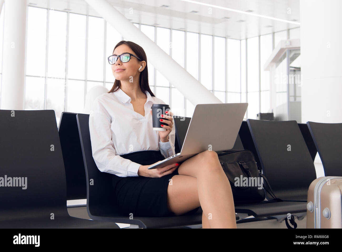 Beautiful business woman waiting airport hi-res stock photography and ...