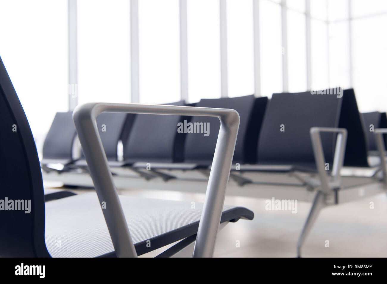Empty airport terminal waiting area with chairs. Close up photo Stock ...