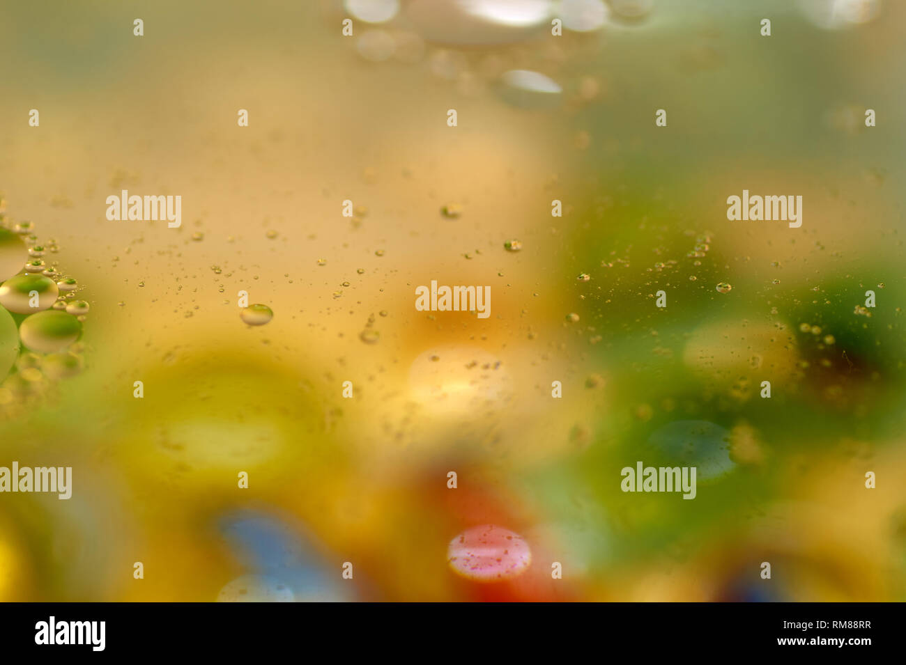 floating in the water abstract colorful, yellow oil drops Stock Photo ...