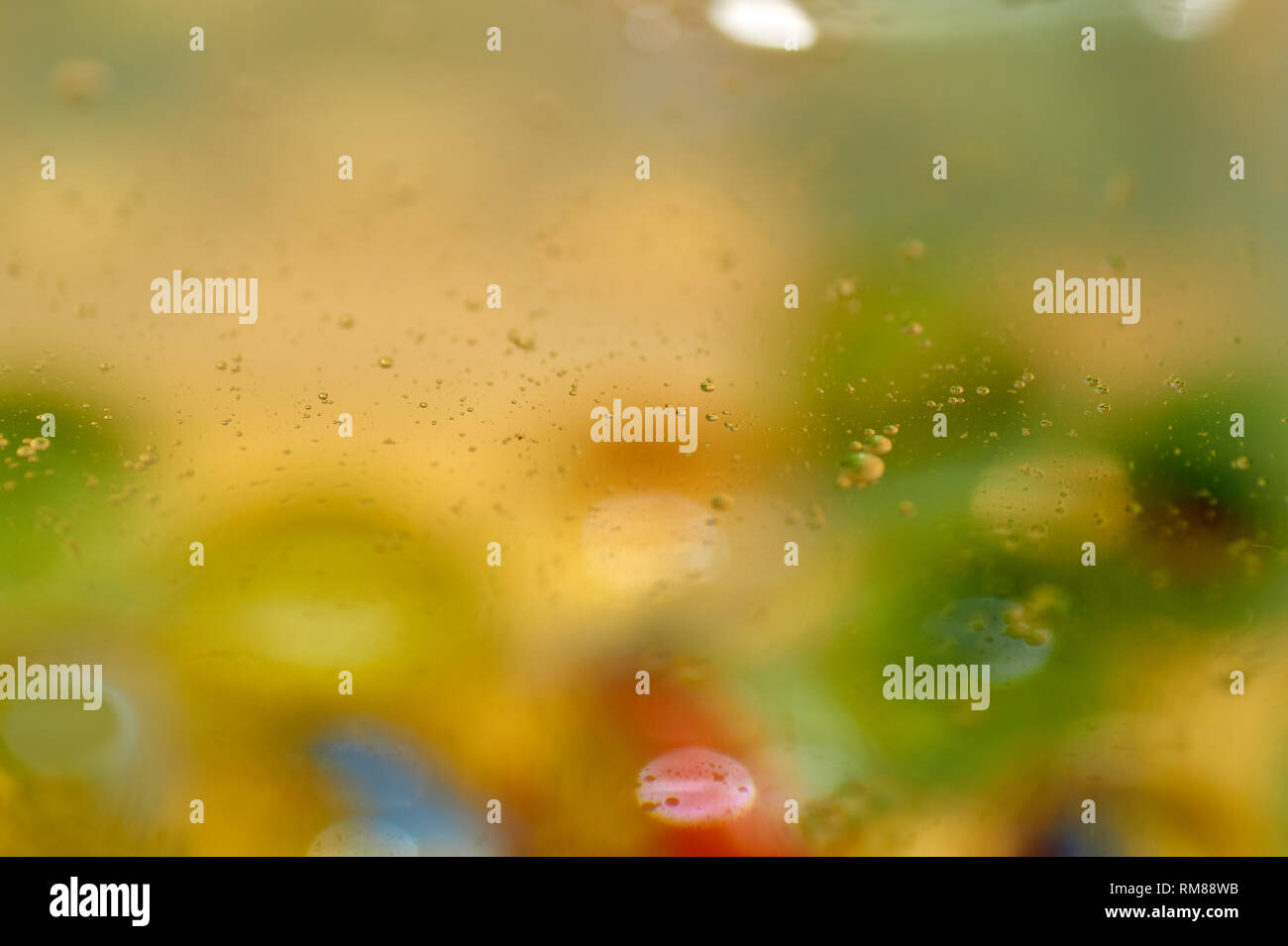 floating in the water abstract colorful, yellow oil drops Stock Photo ...