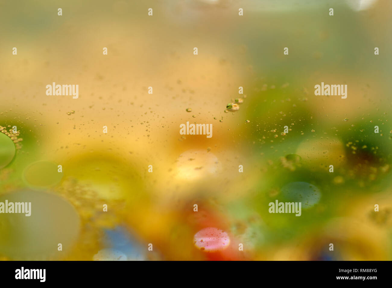 floating in the water abstract colorful, yellow oil drops Stock Photo ...