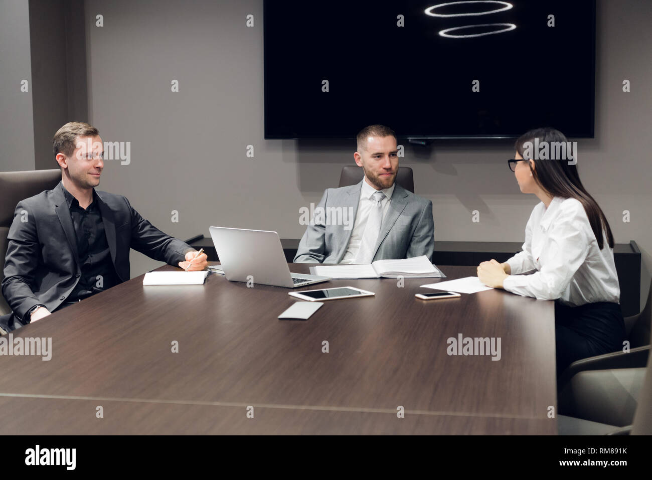 Businesspeople discussing together in conference room during meeting at ...