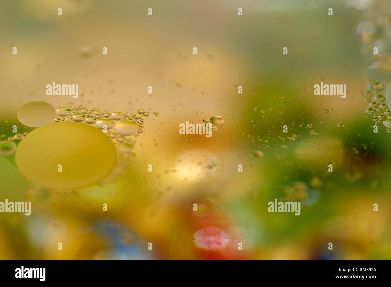floating in the water abstract colorful, yellow oil drops Stock Photo ...