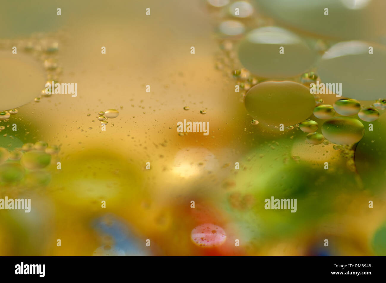 floating in the water abstract colorful, yellow oil drops Stock Photo ...