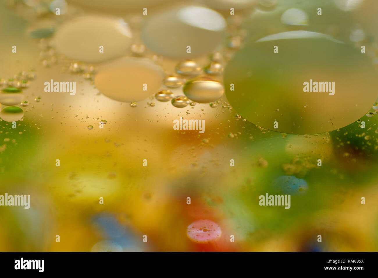 floating in the water abstract colorful, yellow oil drops Stock Photo ...