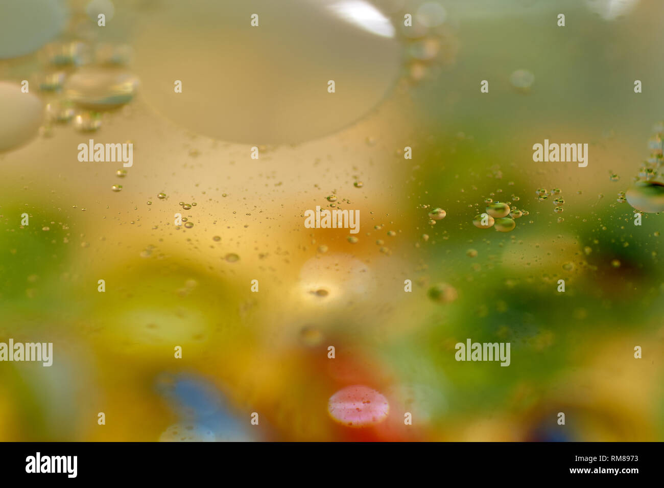 floating in the water abstract colorful, yellow oil drops Stock Photo ...