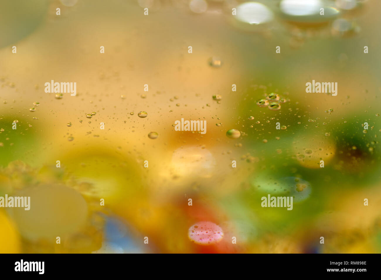 floating in the water abstract colorful, yellow oil drops Stock Photo ...