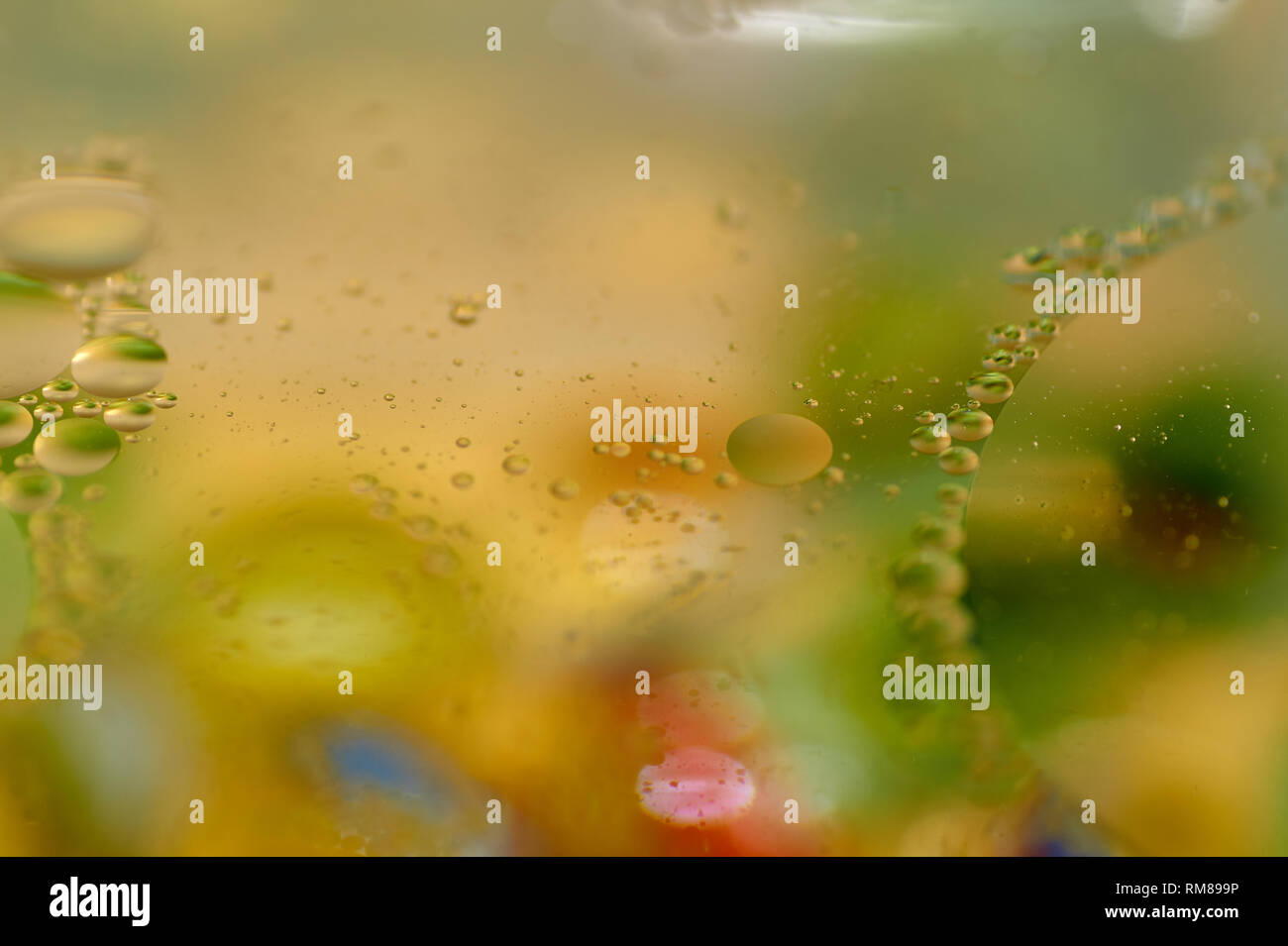 floating in the water abstract colorful, yellow oil drops Stock Photo ...