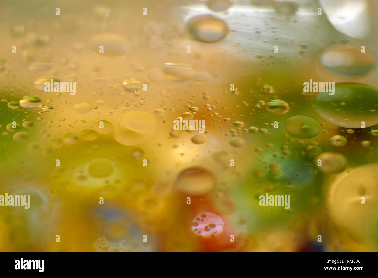 floating in the water abstract colorful, yellow oil drops Stock Photo ...
