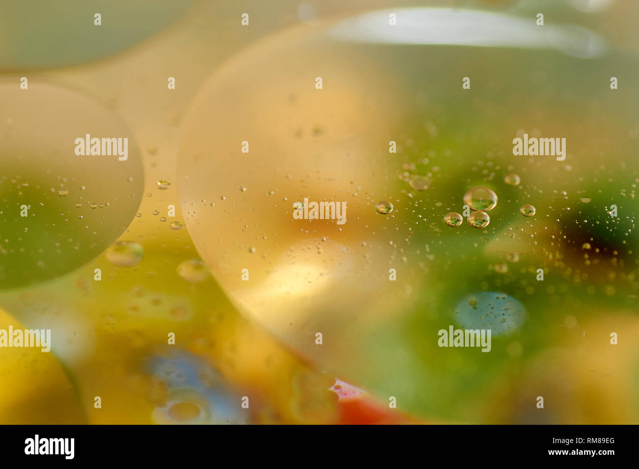 floating in the water abstract colorful, yellow oil drops Stock Photo ...