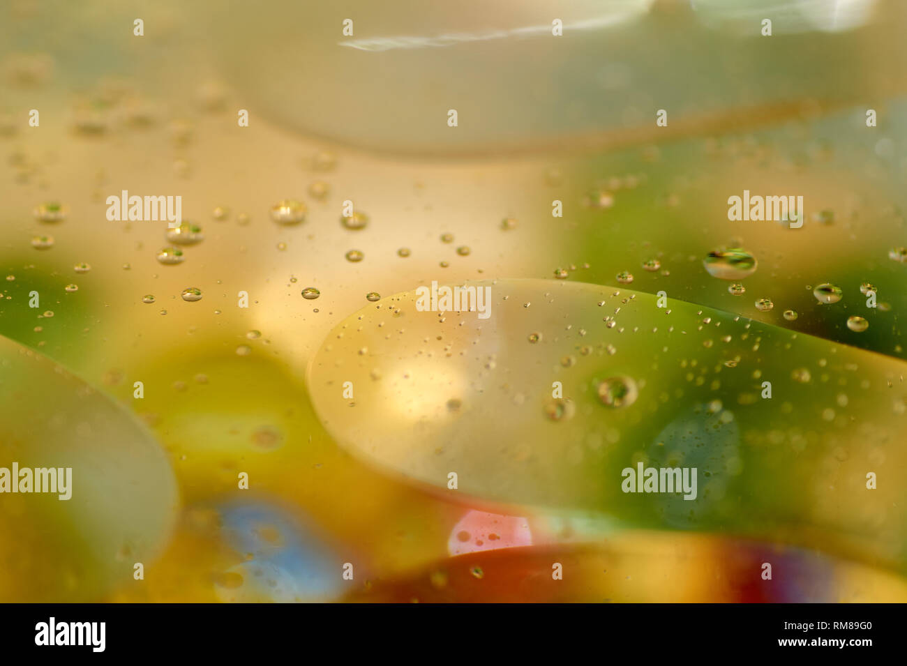 floating in the water abstract colorful, yellow oil drops Stock Photo ...