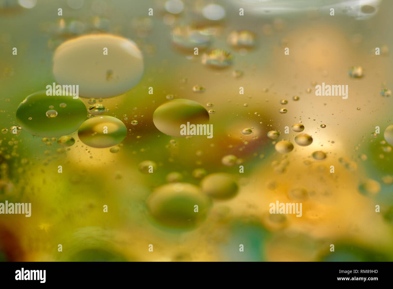 floating in the water abstract colorful, yellow oil drops Stock Photo ...