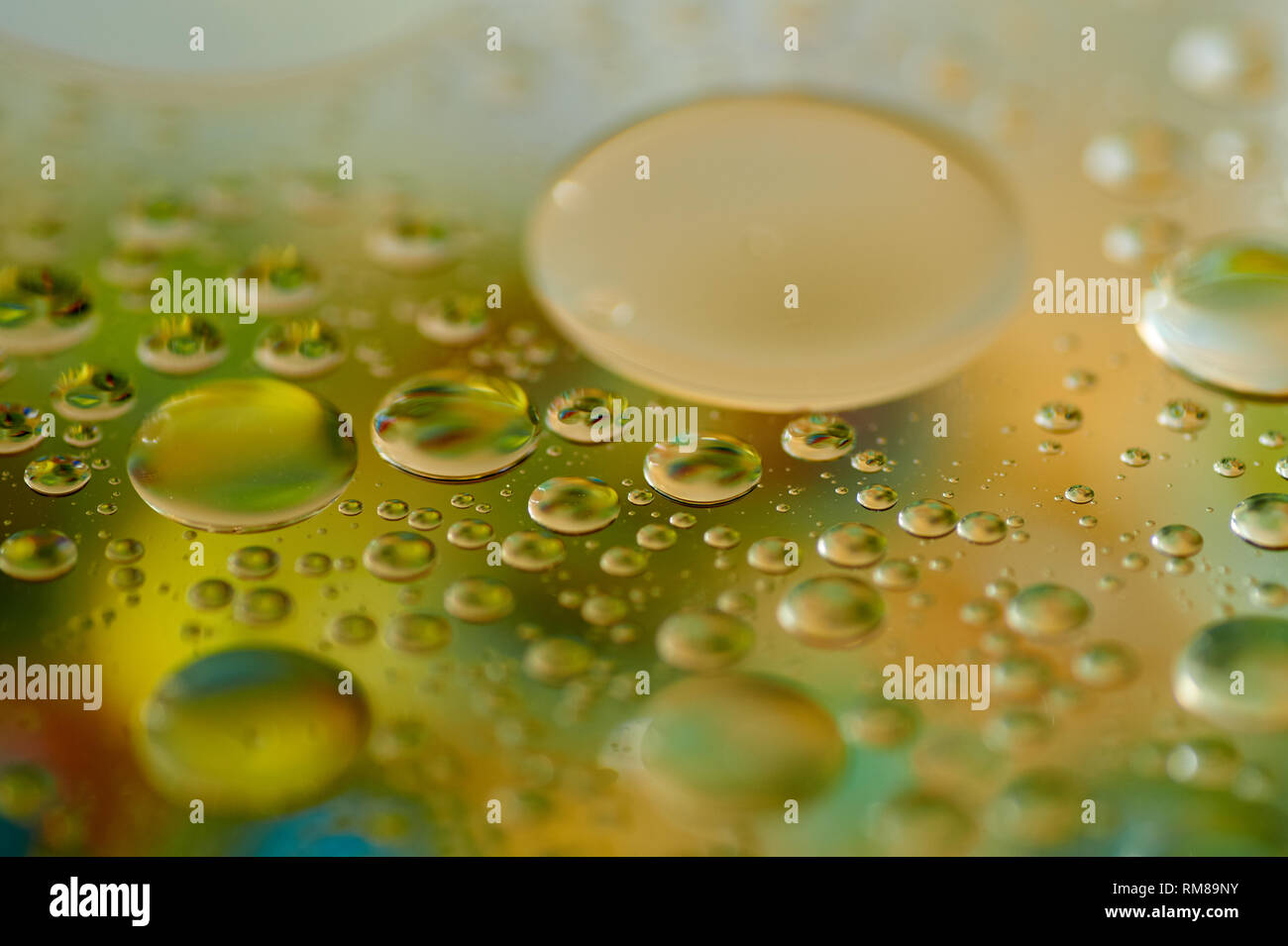 floating in the water abstract colorful, yellow oil drops Stock Photo ...